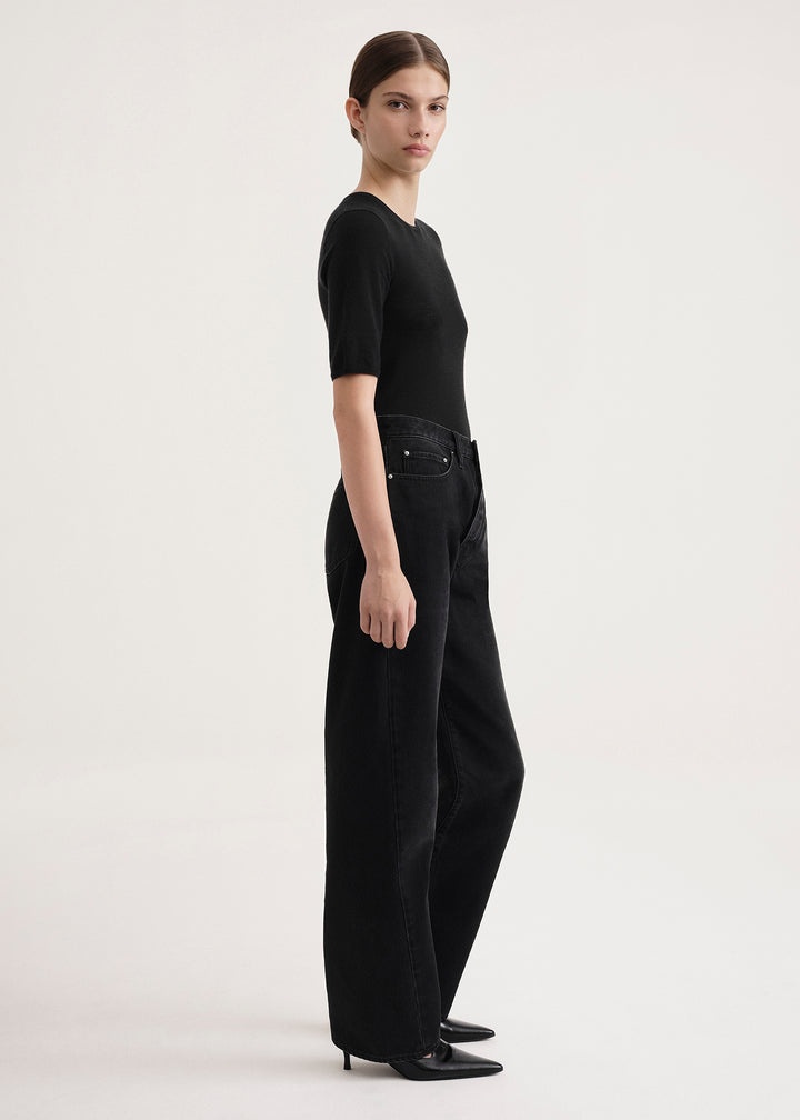 Totême Twisted seam denim full length faded black | REVERSIBLE