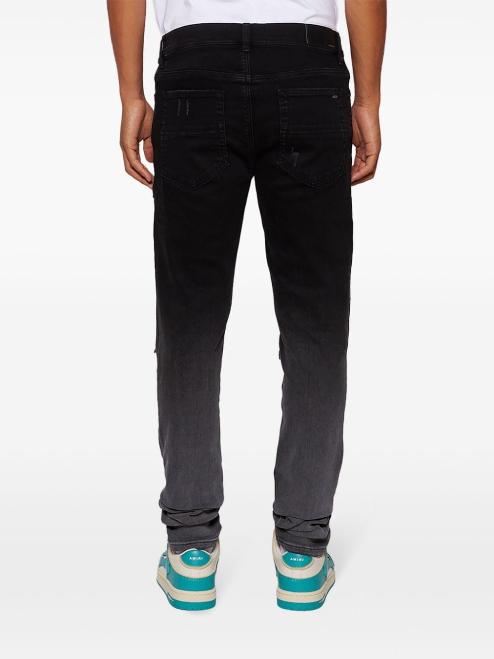 AMIRI ripped skinny-fit jeans | REVERSIBLE